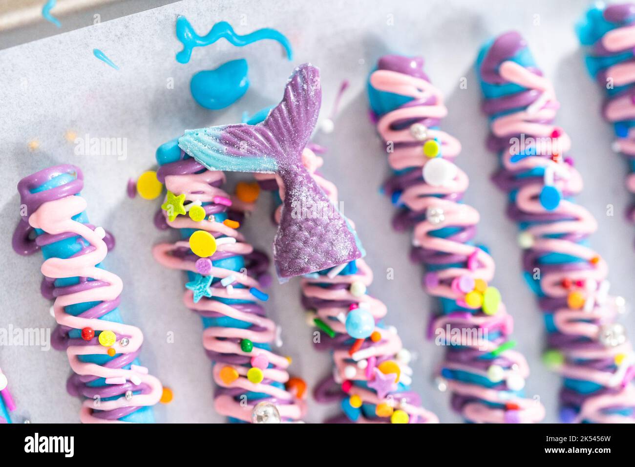 Mermaid chocolate pretzel rods Stock Photo - Alamy