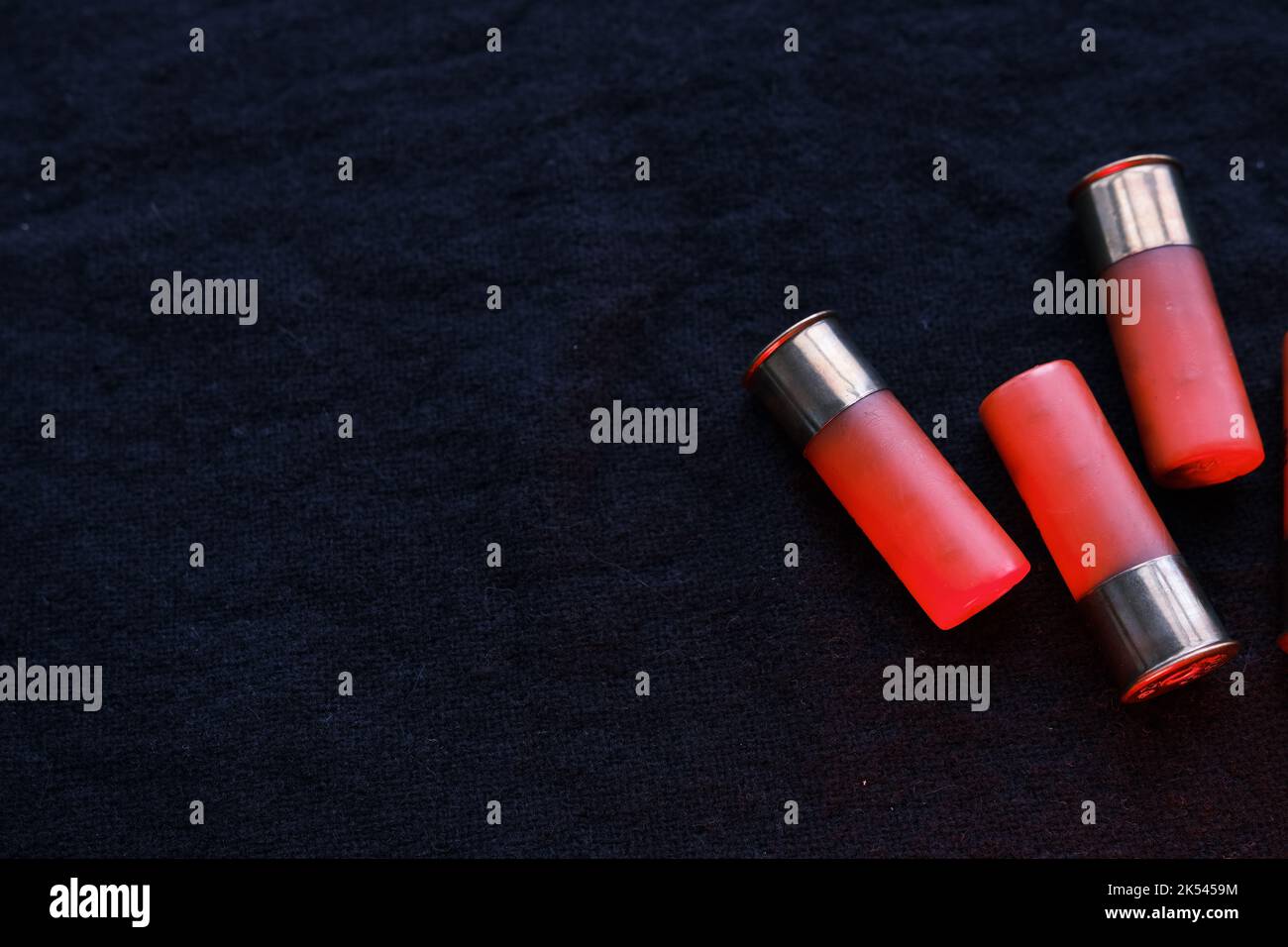 Shotgun shells on a black surface. Ammunition for 12 gauge smoothbore ...