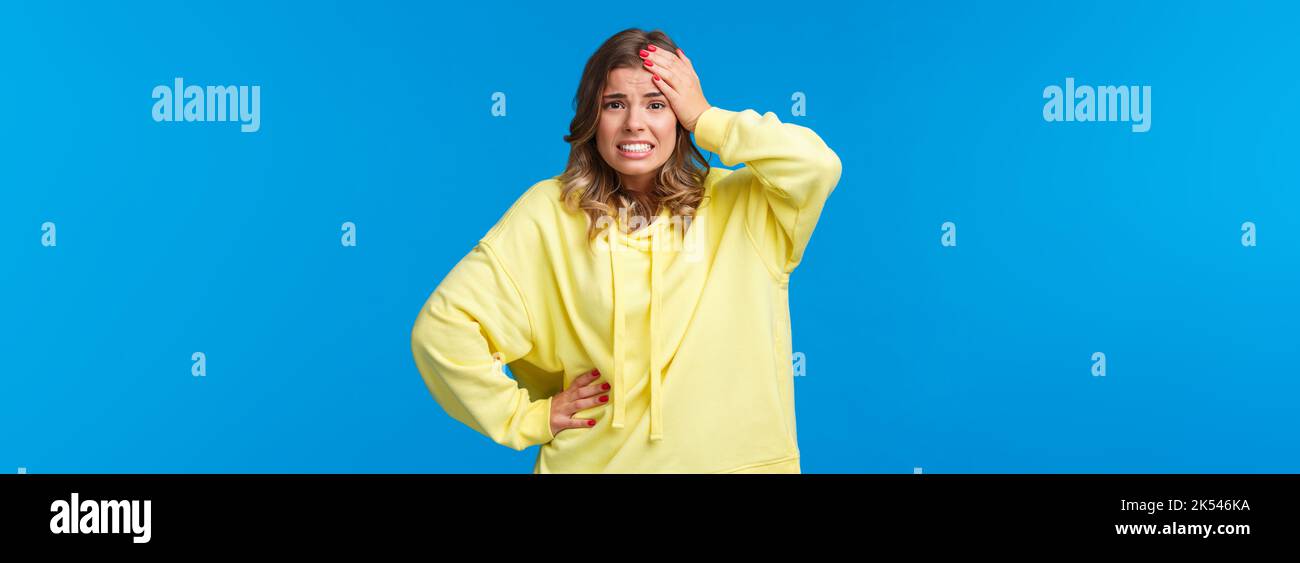 Embarrassed and worried girl bumped into car, feel anxious and ...