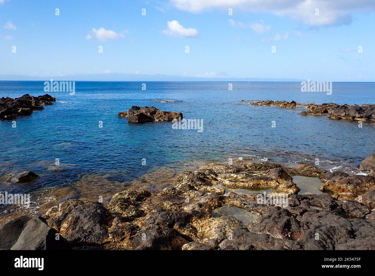The coastline, showing the countryside and ocean of Graciosa Island ...