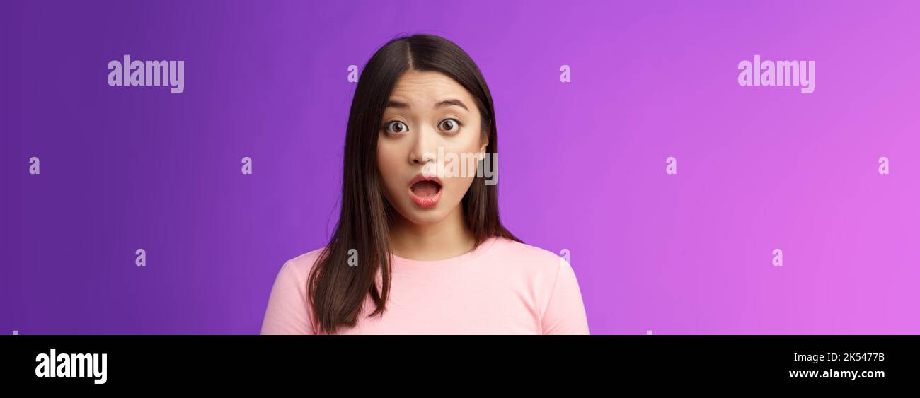 Close-up shocked gasping impressed asian brunette drop jaw stare camera ...
