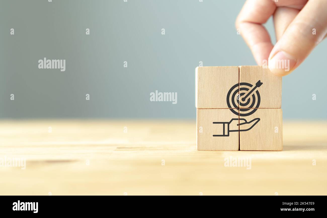 Business goals concept. Strategy and goals achievement. Hand puts ...