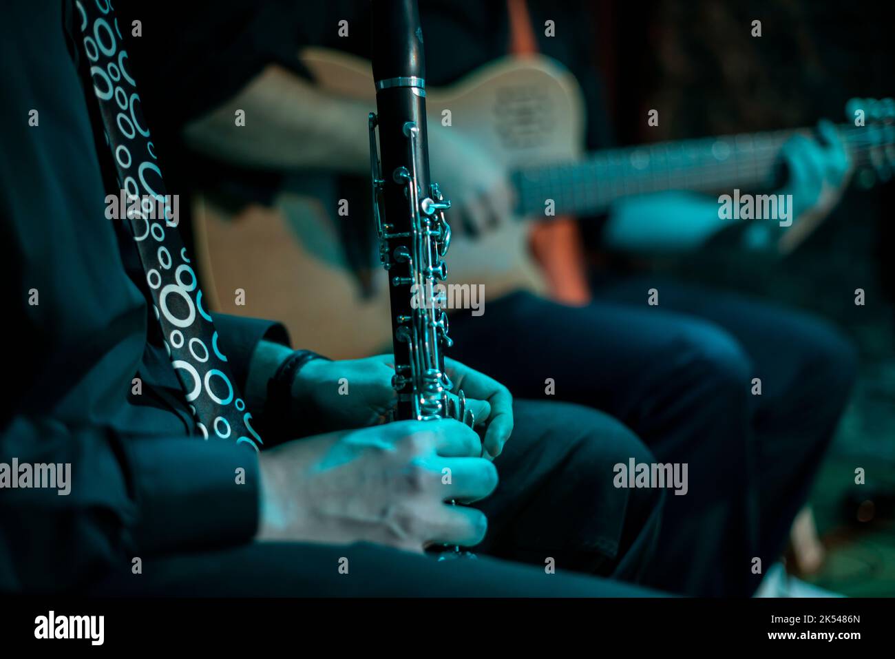 Human hands playing a clarinet hi-res stock photography and images - Alamy