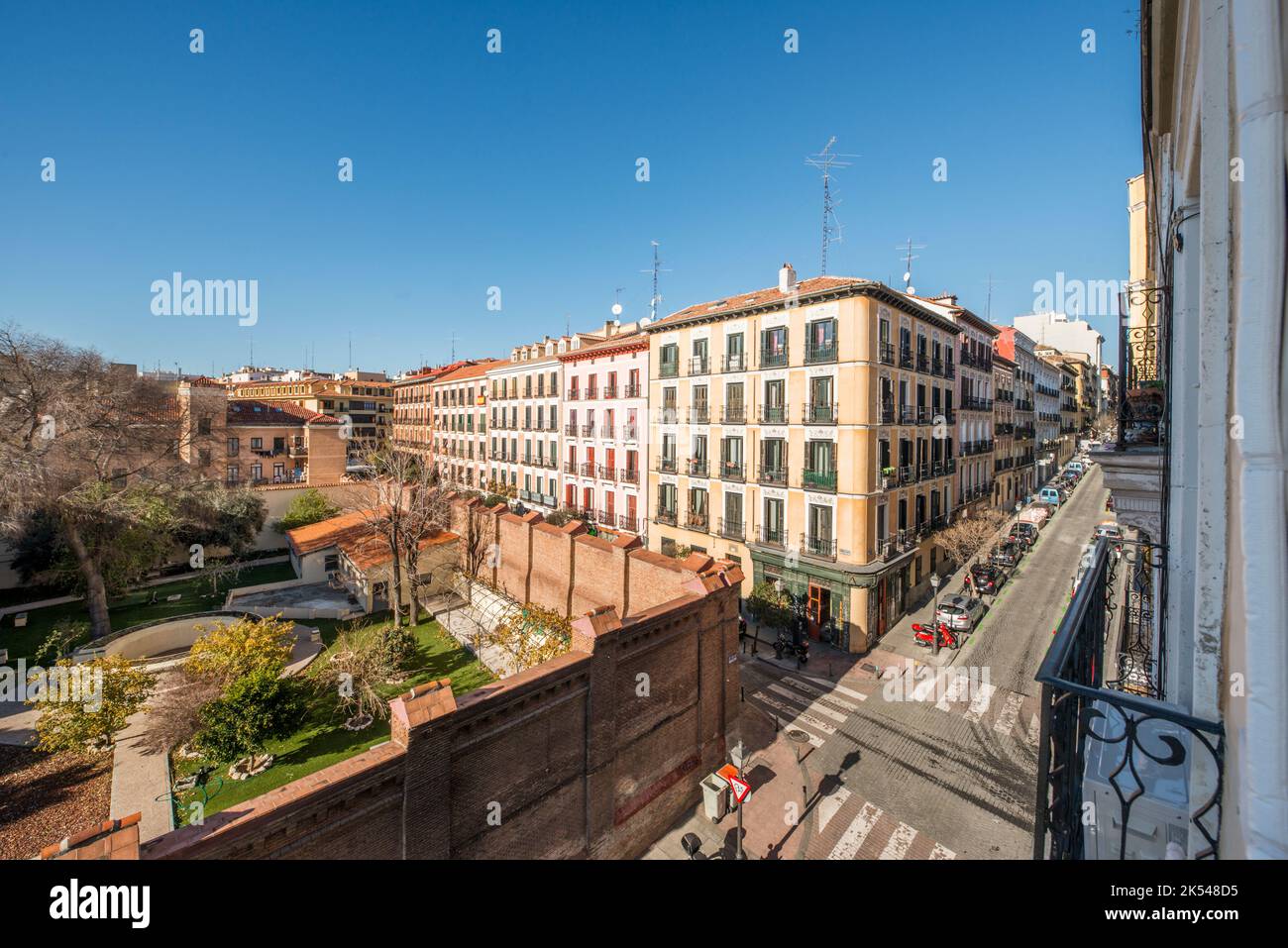 Facades of old residential buildings at a crossroads with cobbled paths ...