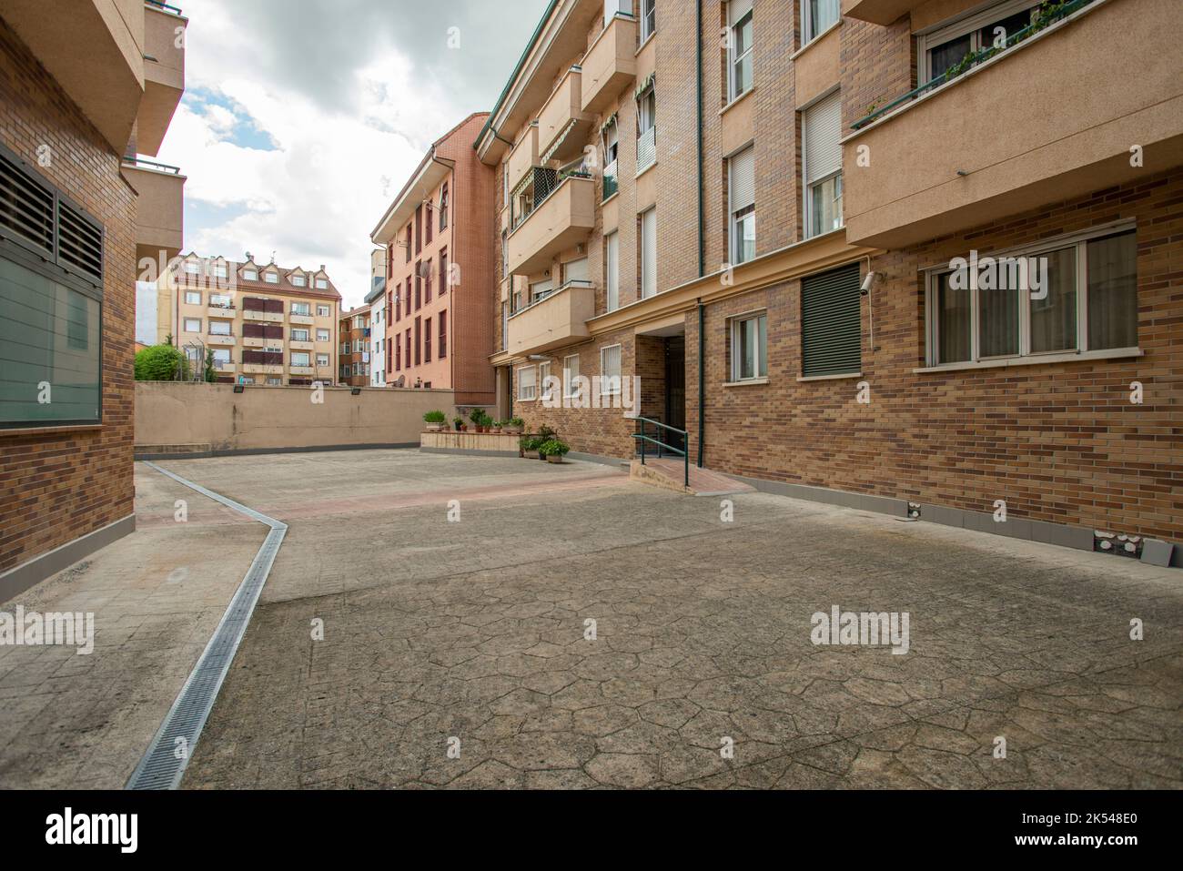 Inner courtyard of urbanization with urban housing buildings on a day ...