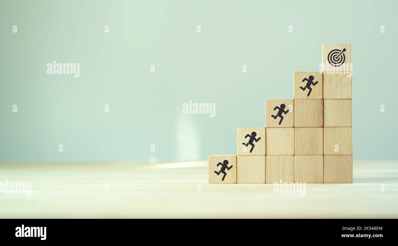 Common goal success concept. Teamwork rises up stairs to goal and ...