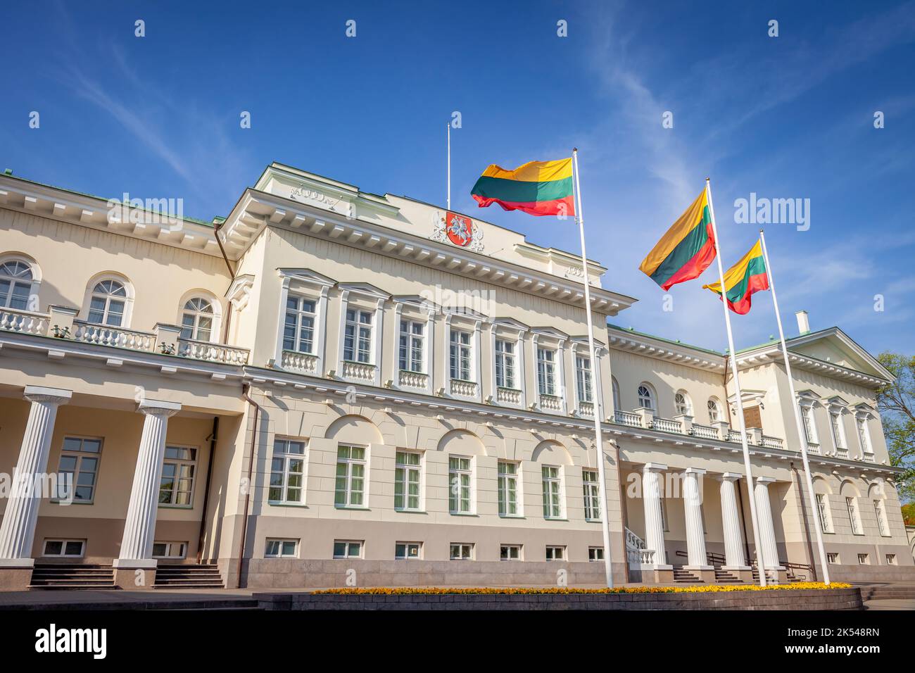Presidential Palace in Vilnius and Lithuanian flags at sunny day ...