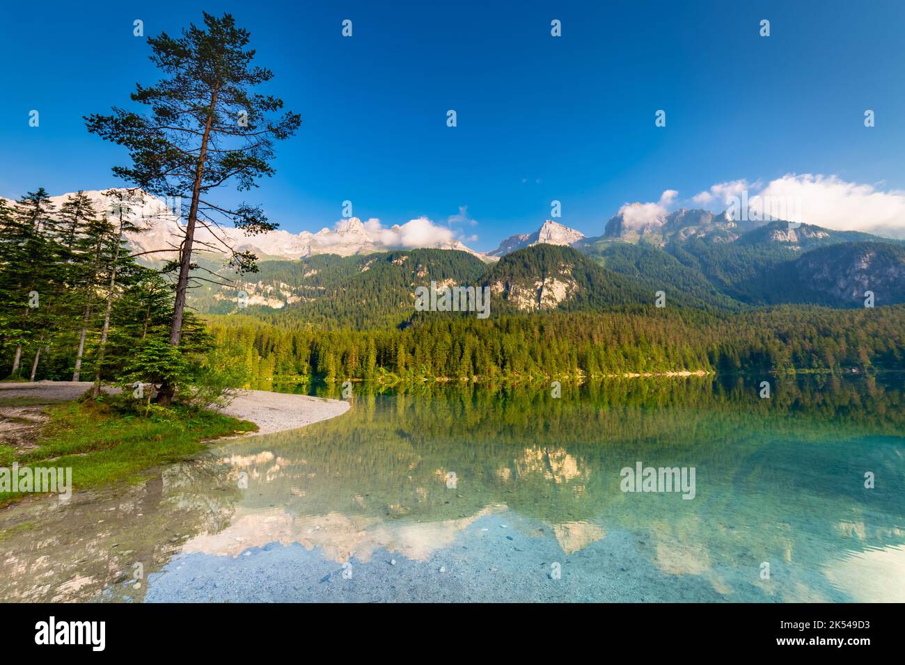 Lake Tovel reflection symmetry in Trentino-Alto Adige, Dolomites, Italy ...