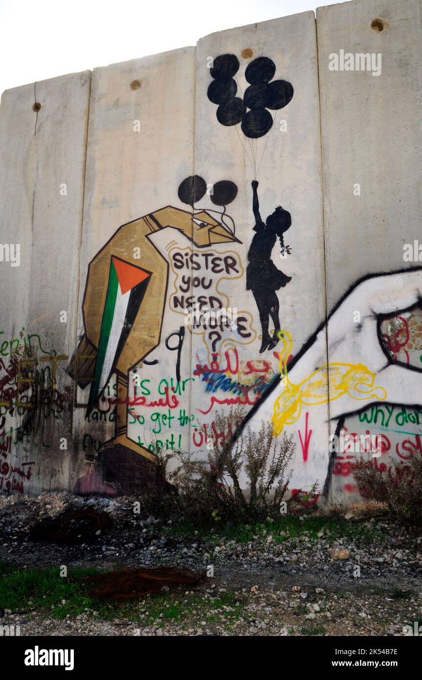 Murals on the Israeli wall barrier near the Kalandia Checkpoint between ...