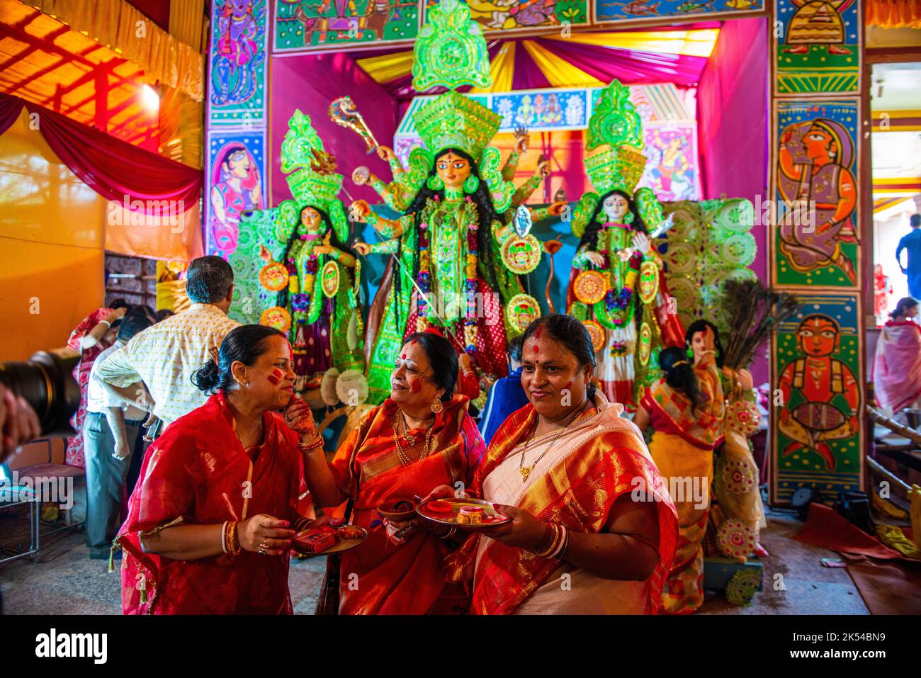 Women apply sindoor (vermilion) on each other's face during the Sindoor ...