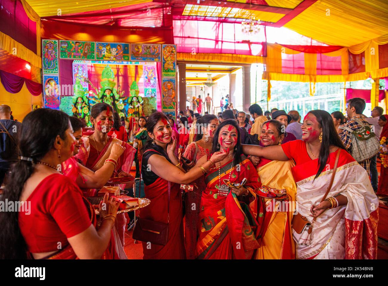Women apply sindoor (vermilion) on each other's face during the Sindoor ...