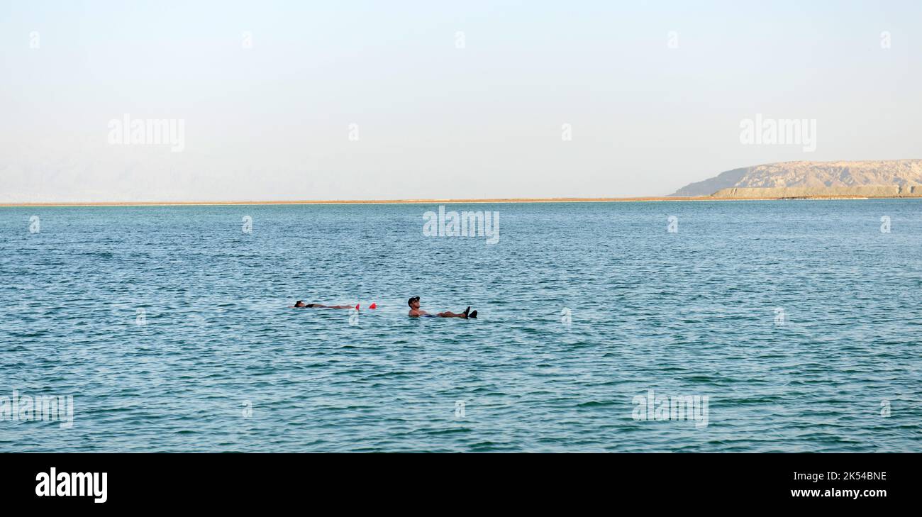Floating and relaxing in the Dead Sea in Israel Stock Photo - Alamy