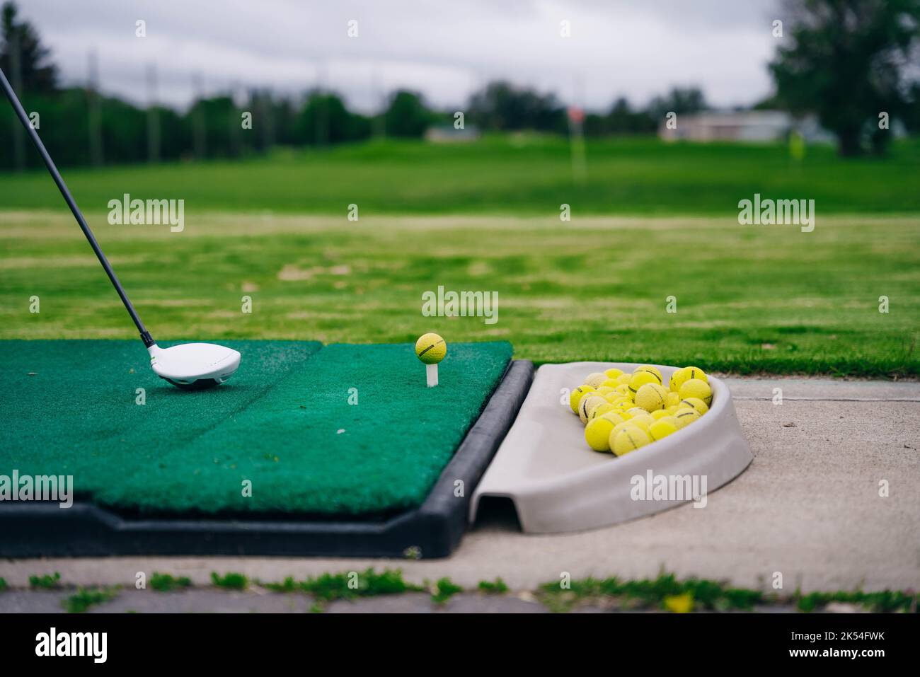 Blurred golf club and golf ball in grass field Stock Photo - Alamy