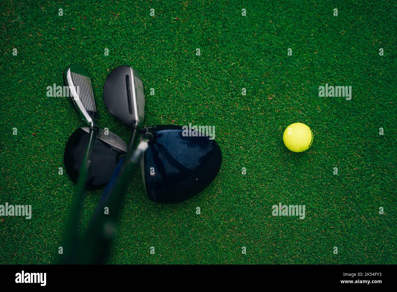 Blurred golf club and golf ball in grass field Stock Photo - Alamy