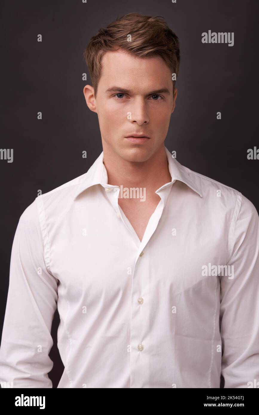 Young and stylish. Portrait of a handsome young man looking wearing a ...