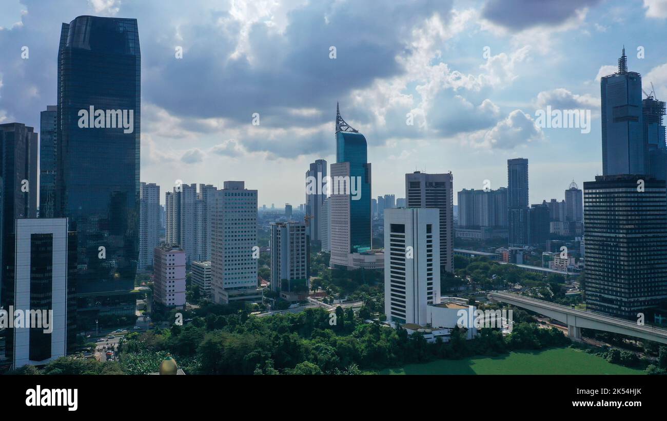 Aerial view of beautiful Jakarta downtown under blue sky at morning ...