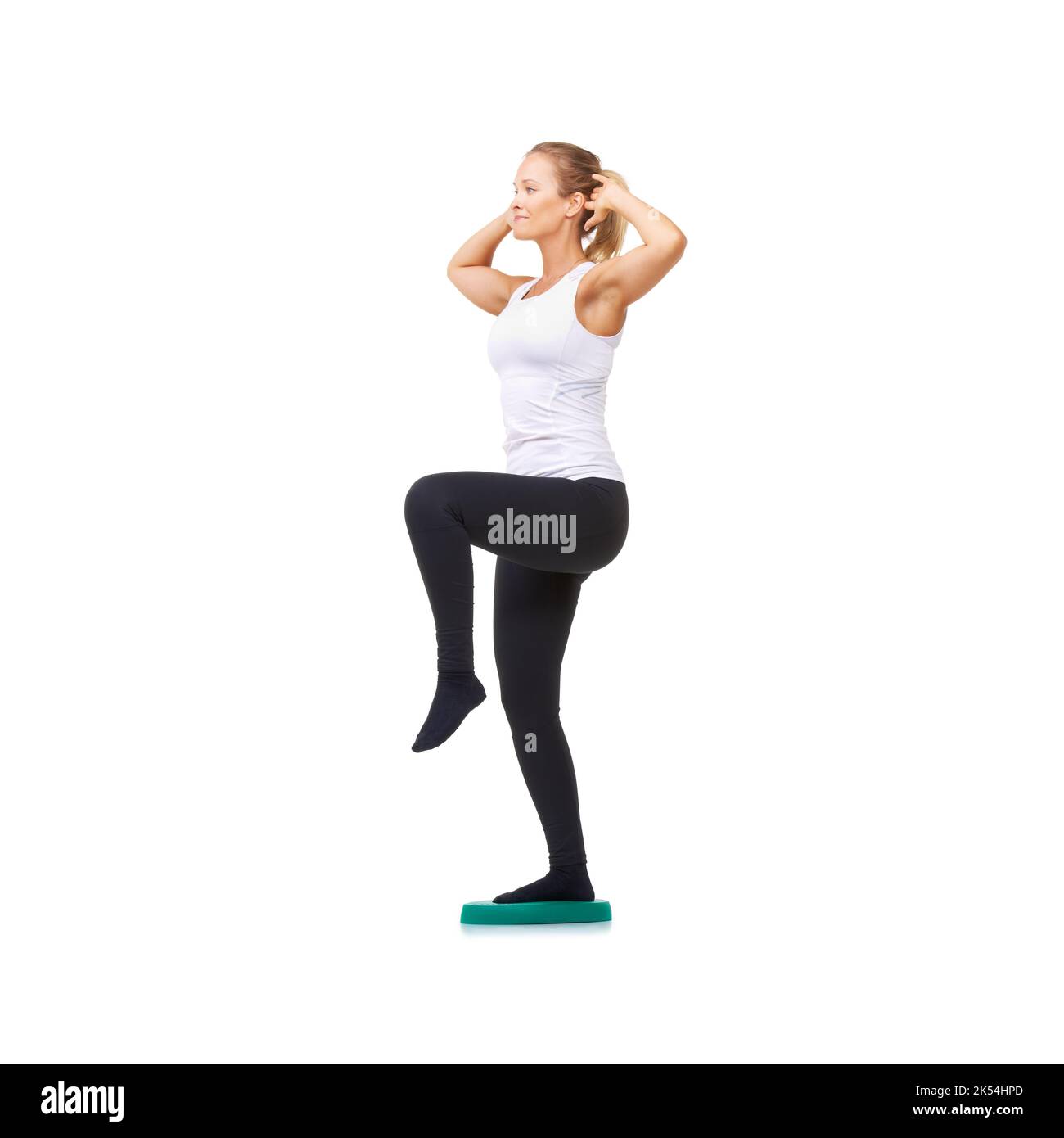 Focusing on her posture. Full length studio shot of a woman doing ...