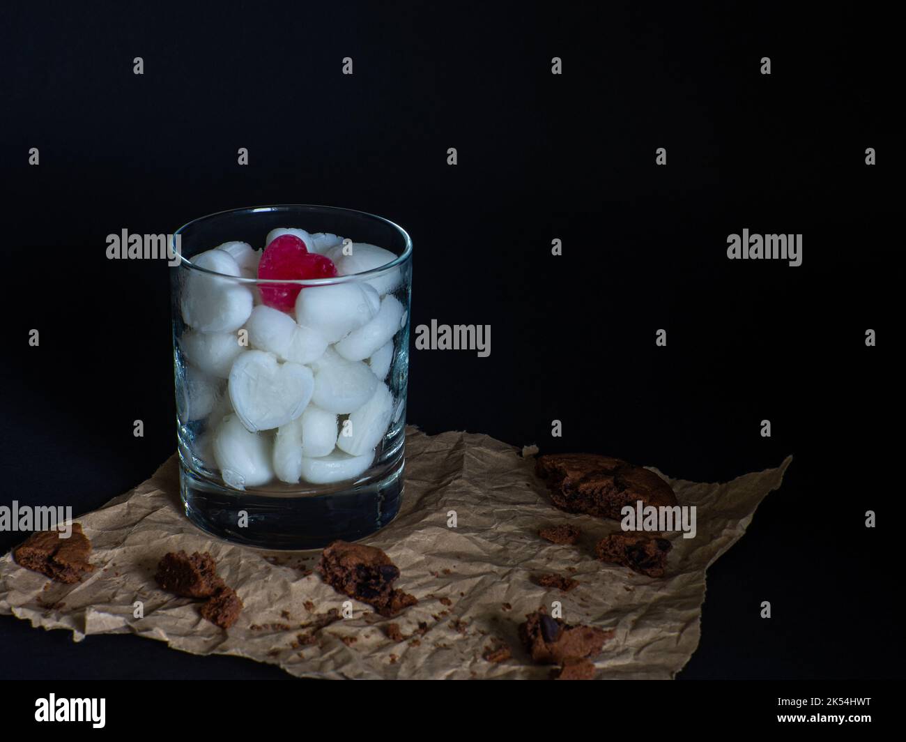 Ice cubes made from milk in heart shape in glass Stock Photo - Alamy