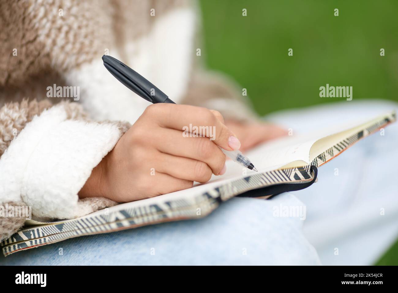 One woman pen paper smiling summer hi-res stock photography and images ...