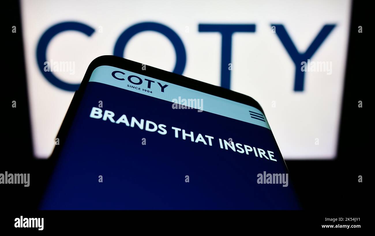 Smartphone with website of US beauty company Coty Inc. on screen in ...