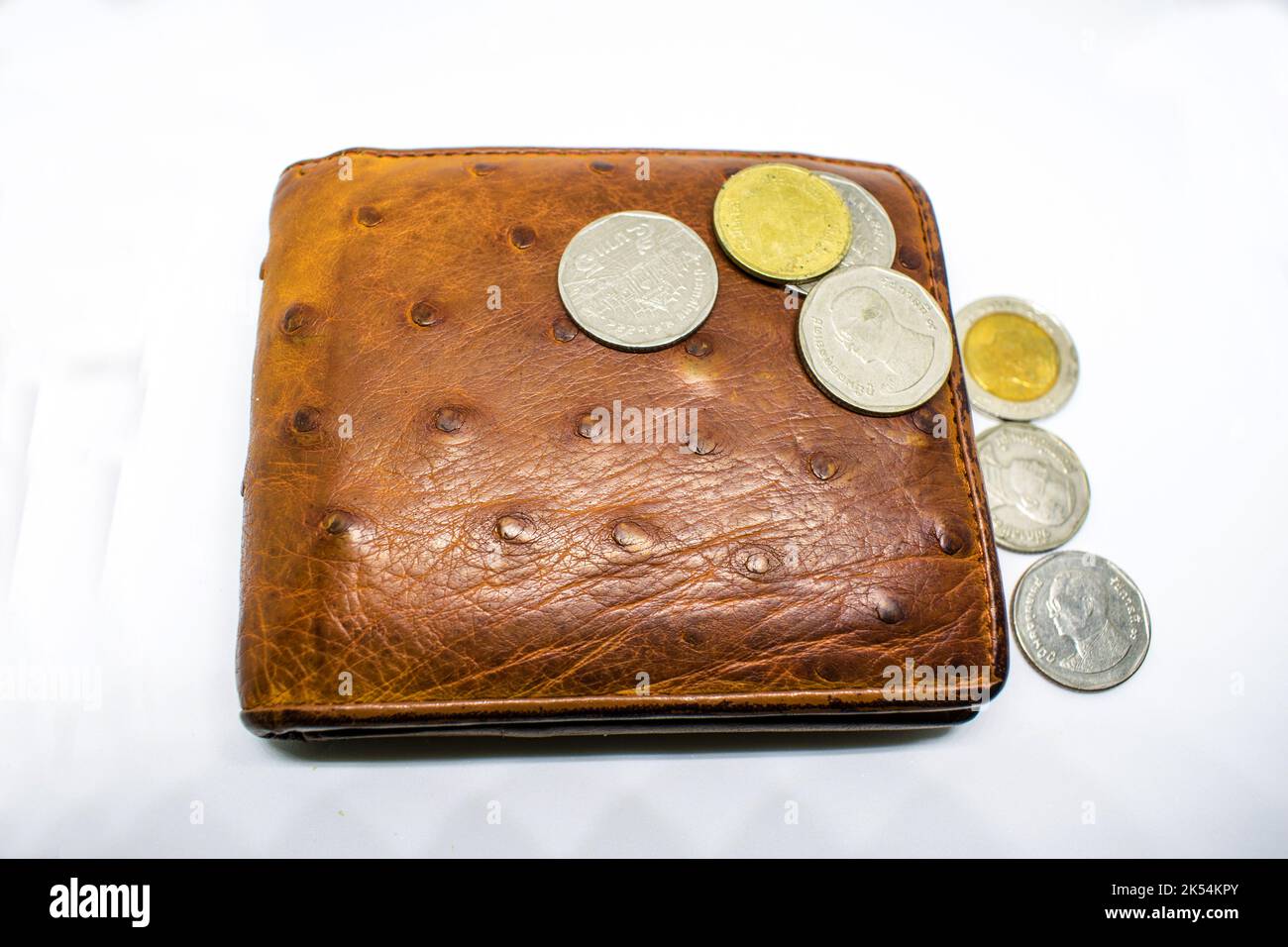 men's brown wallet money in cash white background Stock Photo - Alamy