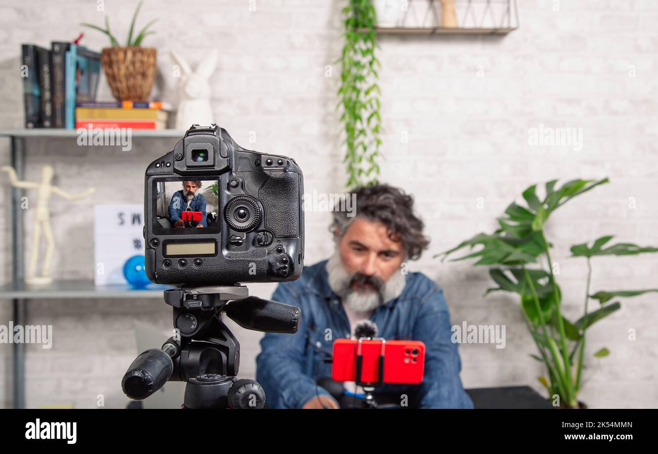 Talking while shooting a video hi-res stock photography and images - Alamy