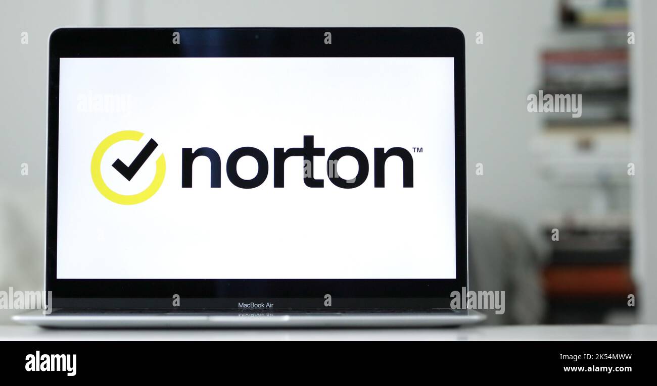 A logo design of norton on a laptop screen in blurred background Stock ...