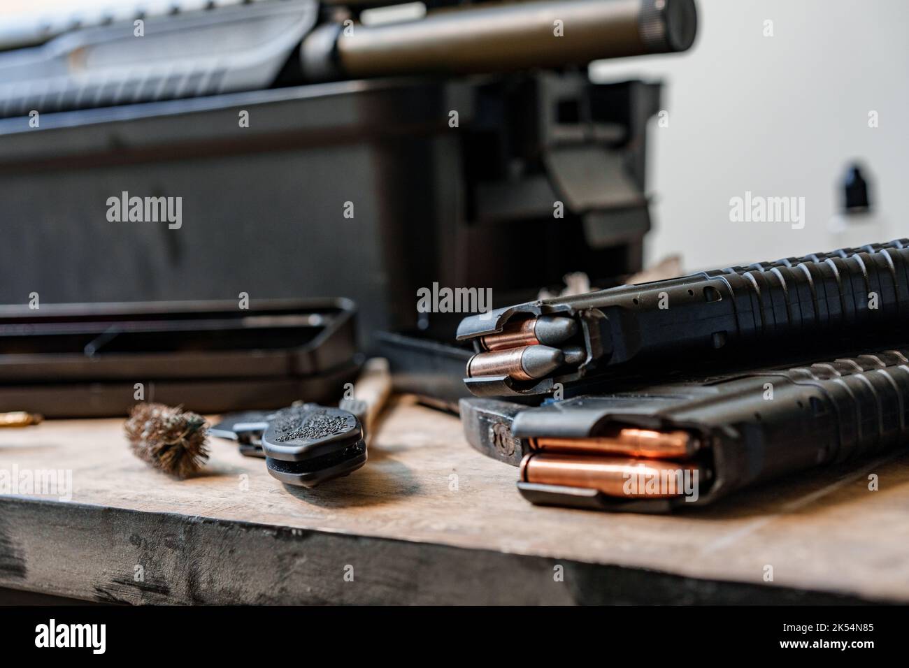 Shotgun rifle with cartridges on table in a weapon workshop Stock Photo ...