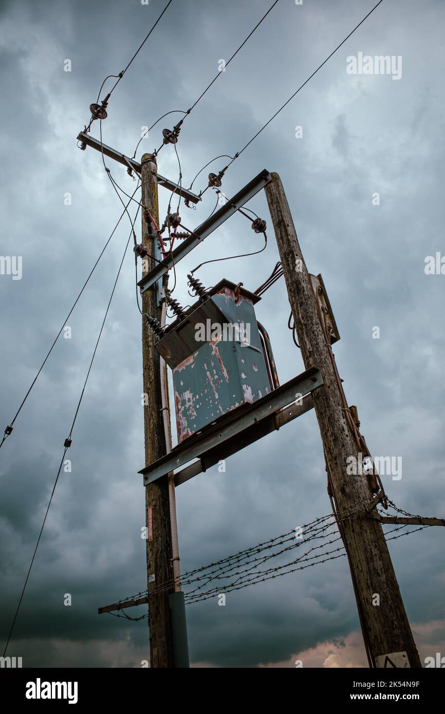 electricity supply wooden pylon post and transformer Stock Photo - Alamy