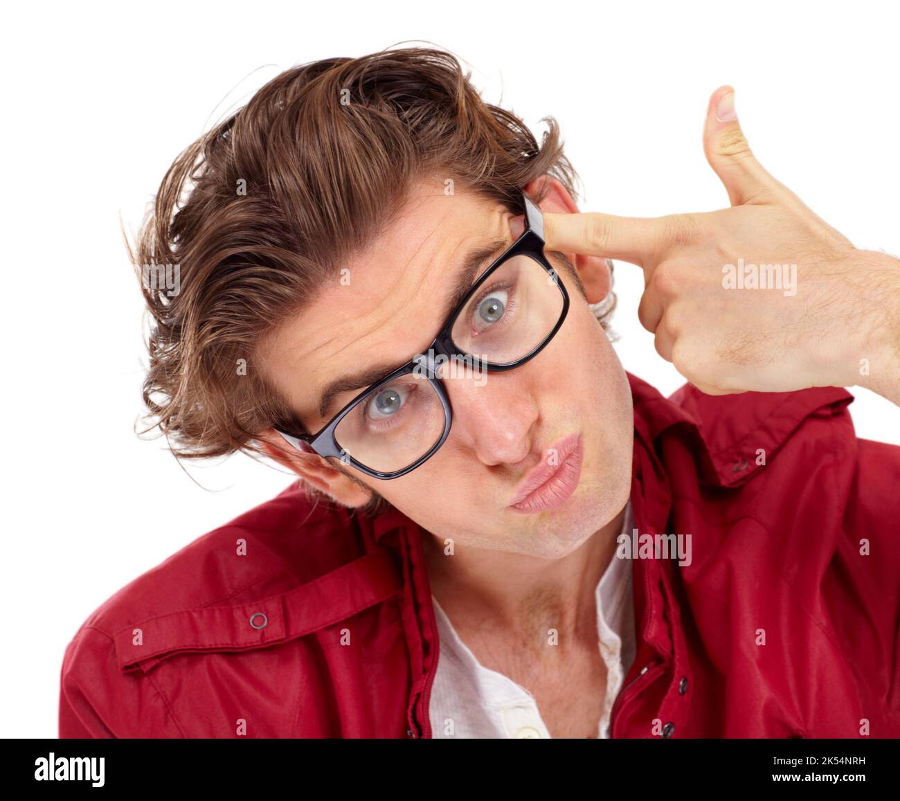Time to use your brain. Young man posing with his finger against his ...