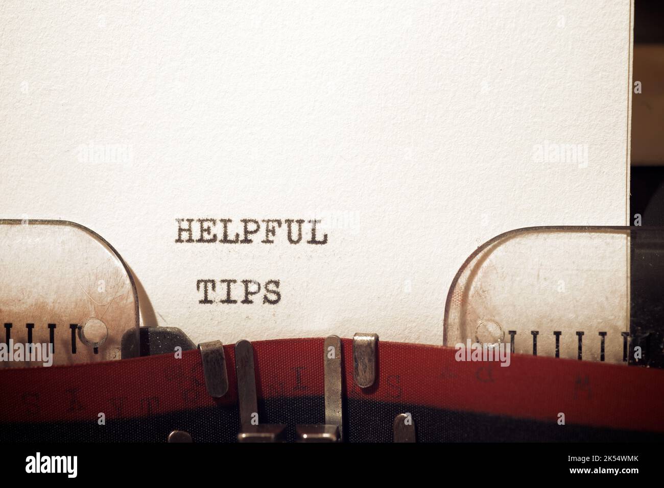 Helpful tips text written with a typewriter Stock Photo - Alamy
