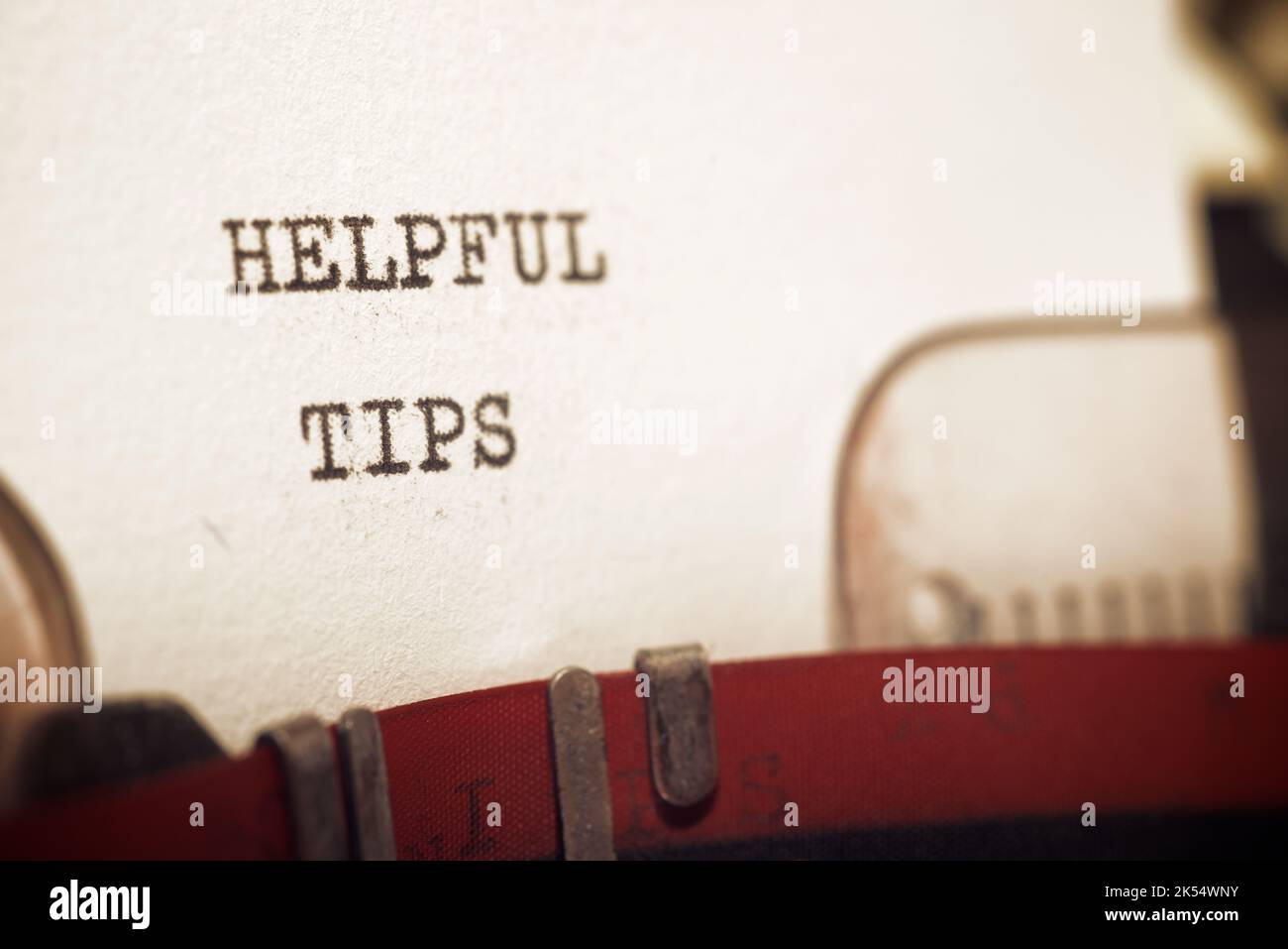 Helpful tips text written with a typewriter Stock Photo - Alamy