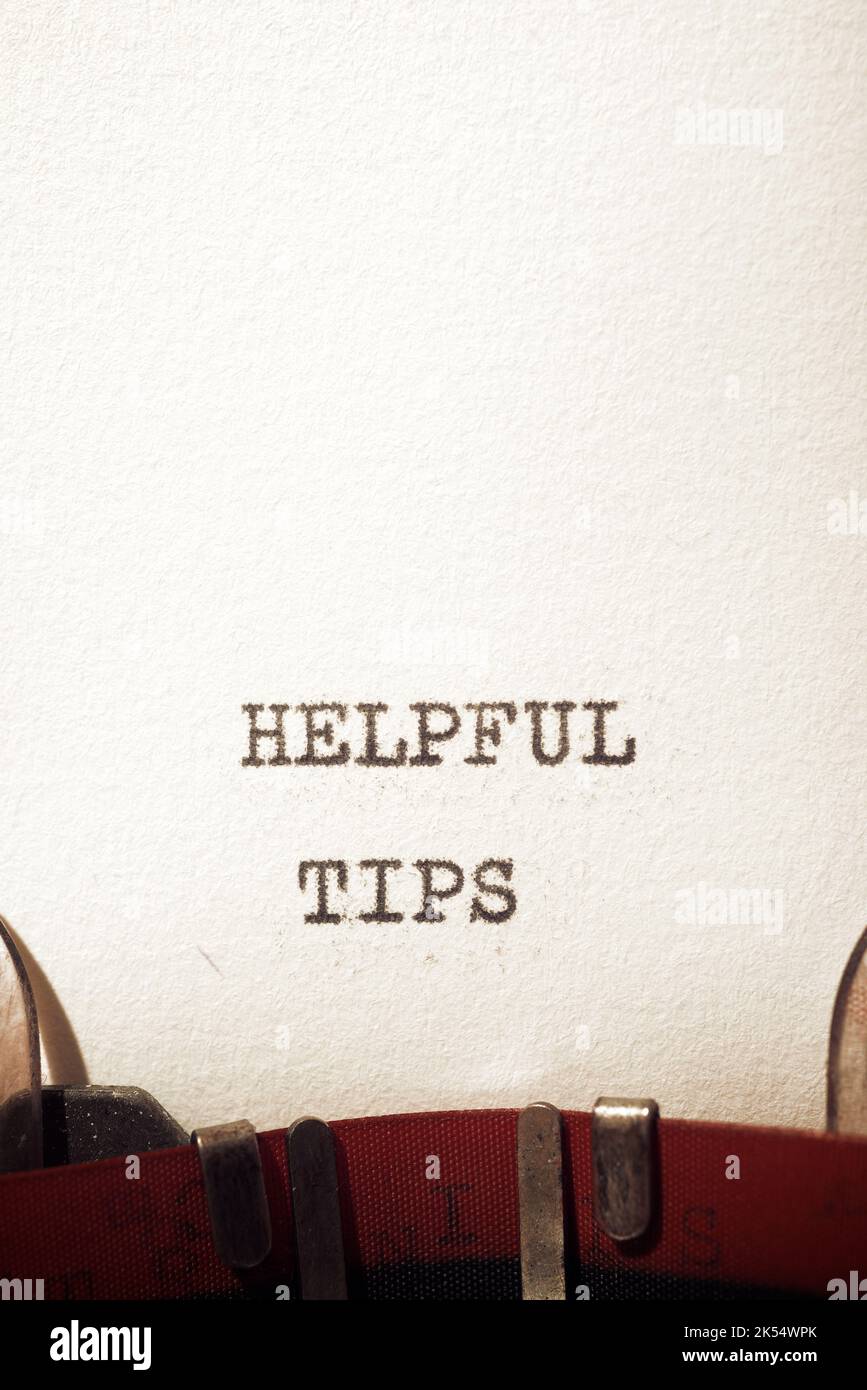 Helpful tips text written with a typewriter Stock Photo - Alamy