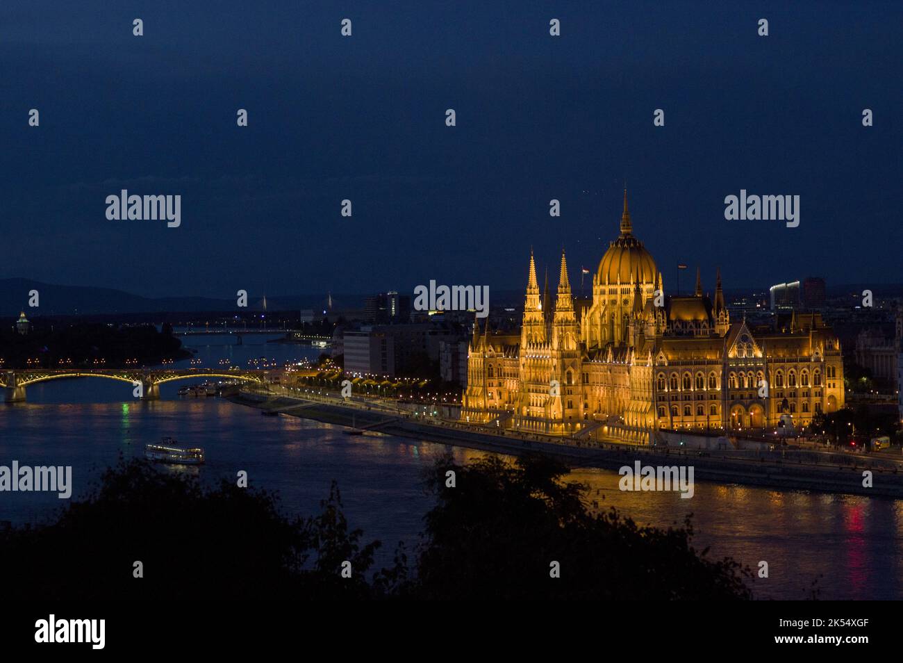 Night view of the Hungarian Parliament Building Országház or Parliament of Budapest located on ...