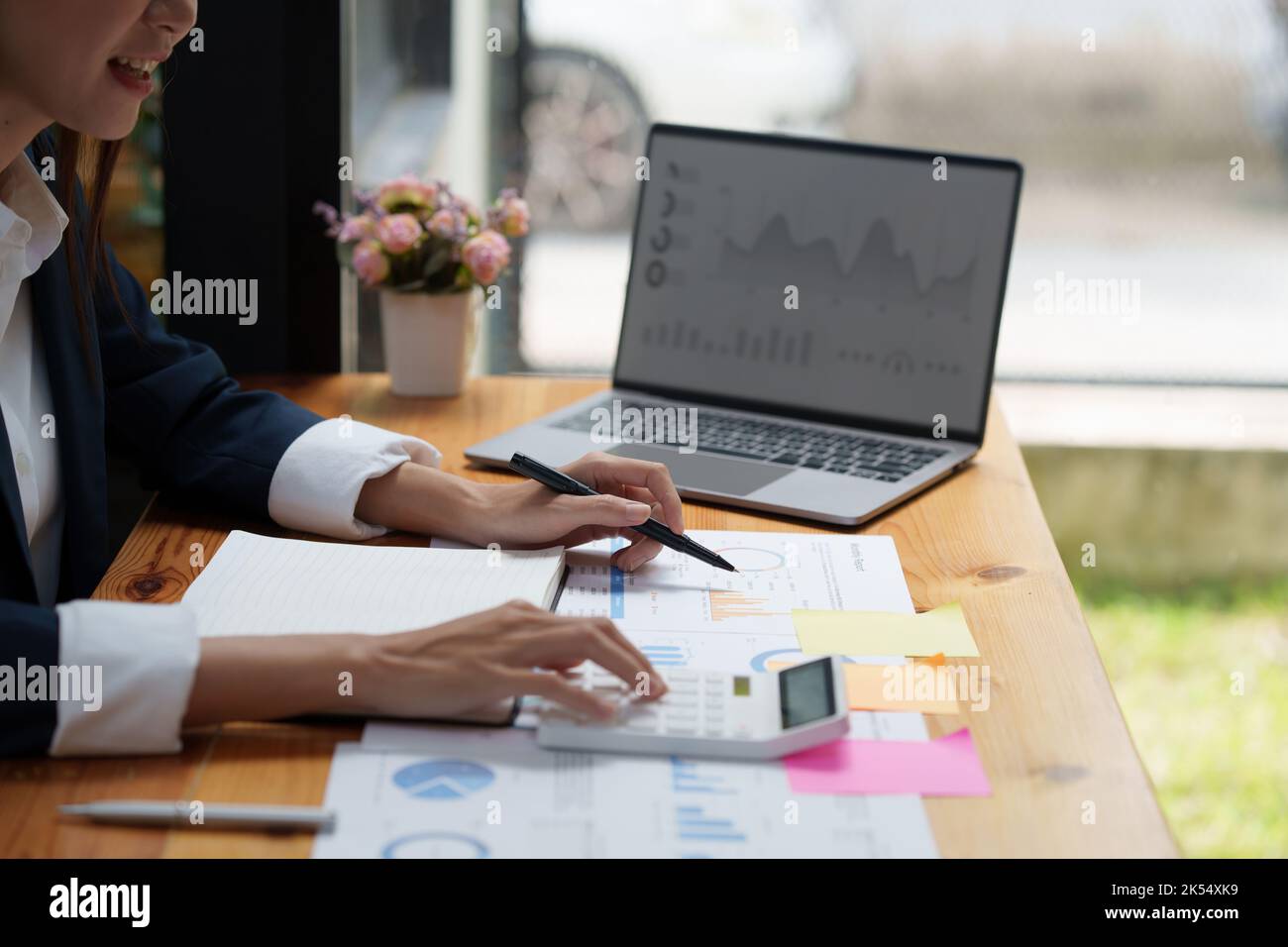 Close up Business woman hand using calculator to calculate the company ...