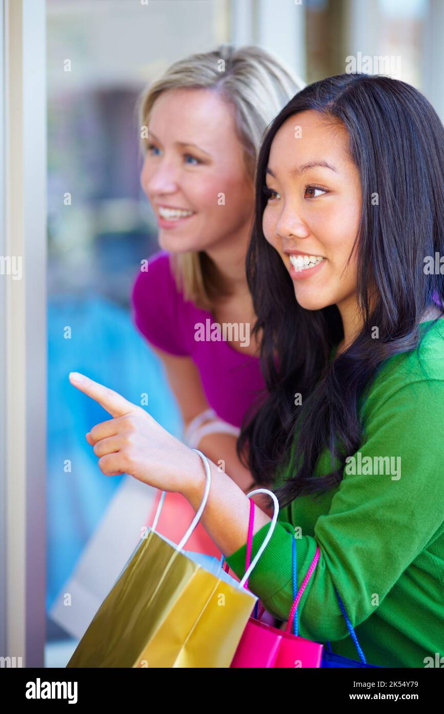 We need to go into that store. Two woman looking excitedly in the ...