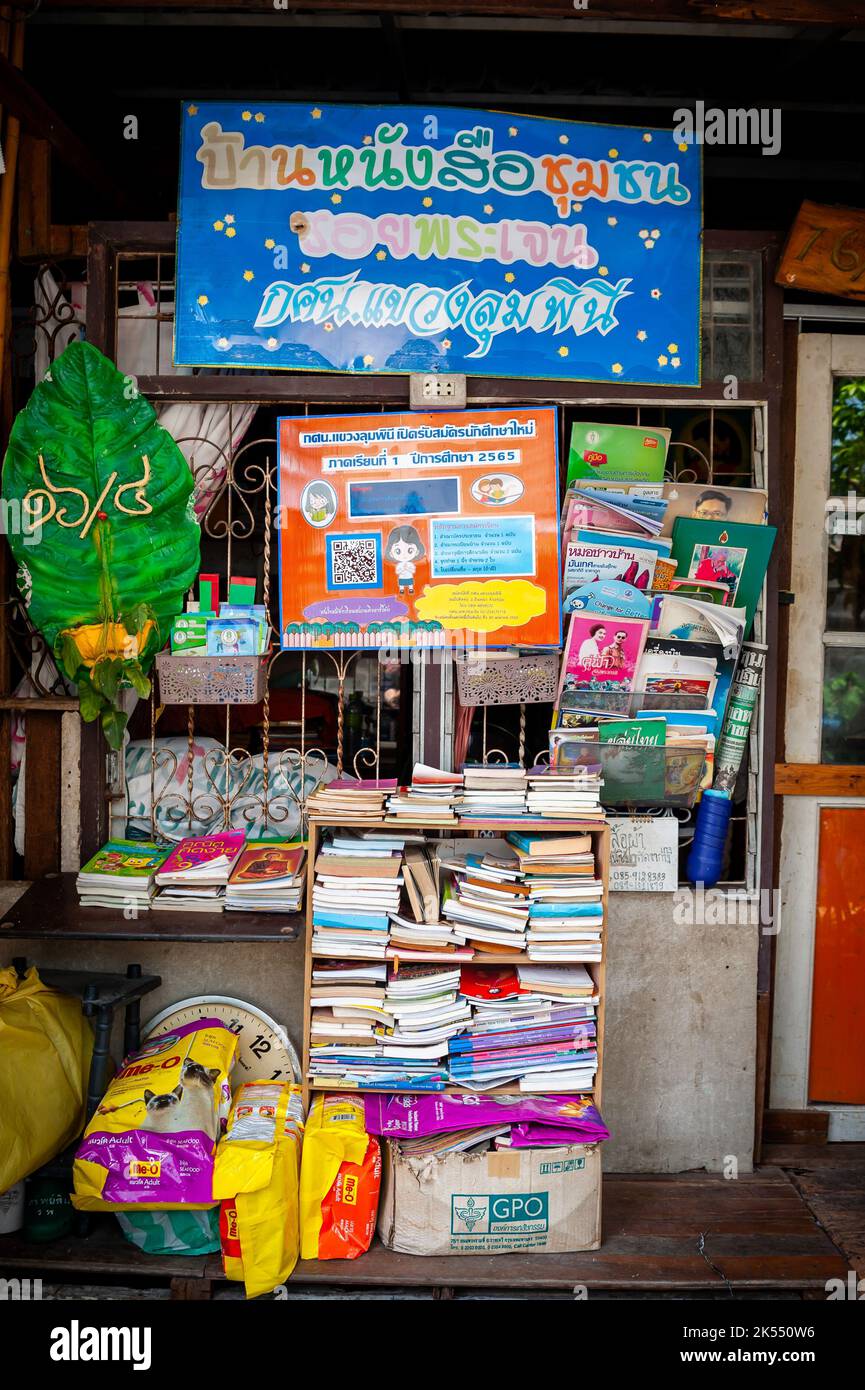 A little book shop outside a home in the Soi Ruamrudee community area ...