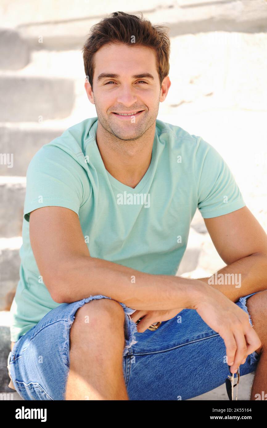 His happy to hang around and take things easy. Portrait of a handsome ...