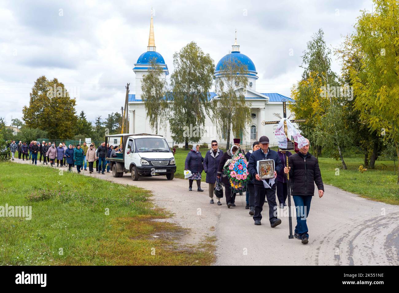 The procession with the deceased leaves the church. Funeral ceremony ...