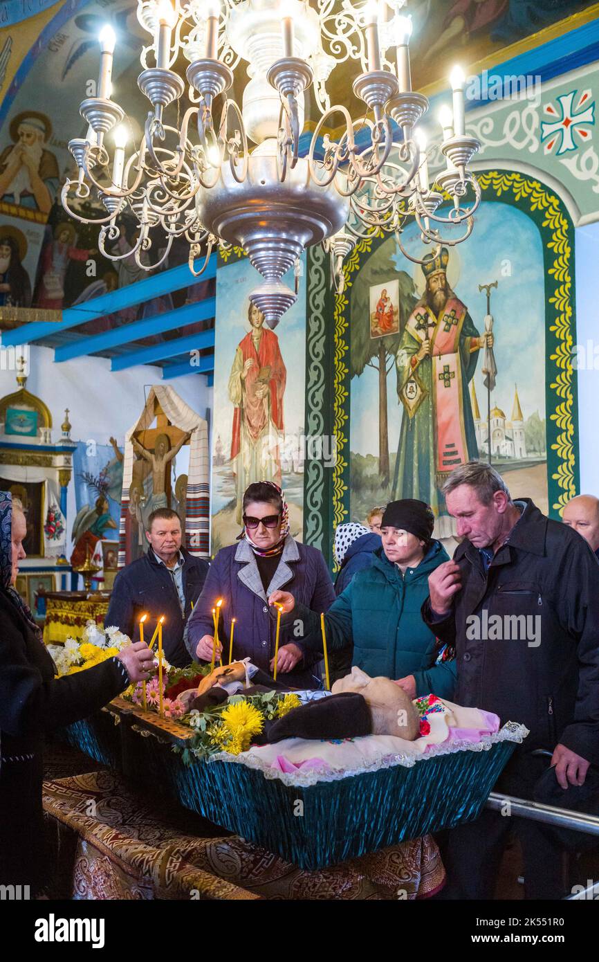 Ceremony with the priest pope in the church, the family embraces the ...
