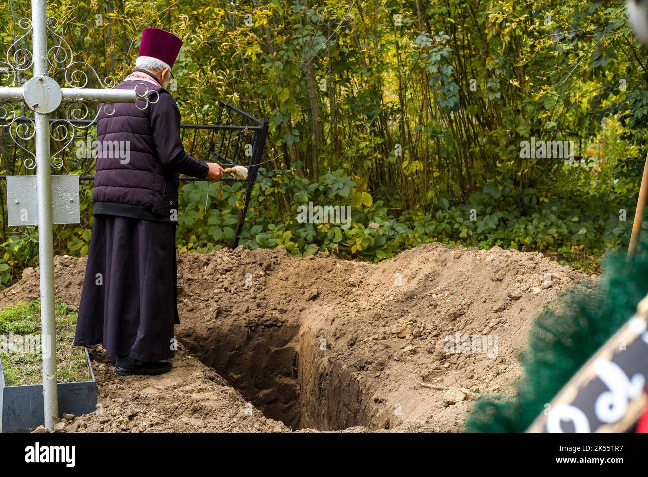 Ceremony and burial at the cemetery, a last goodbye to the deceased ...
