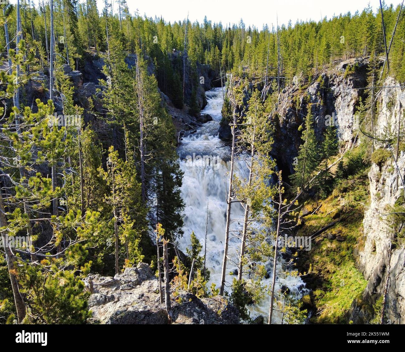 A beautiful view of Kepler Cascades waterfall along Firehole River in ...