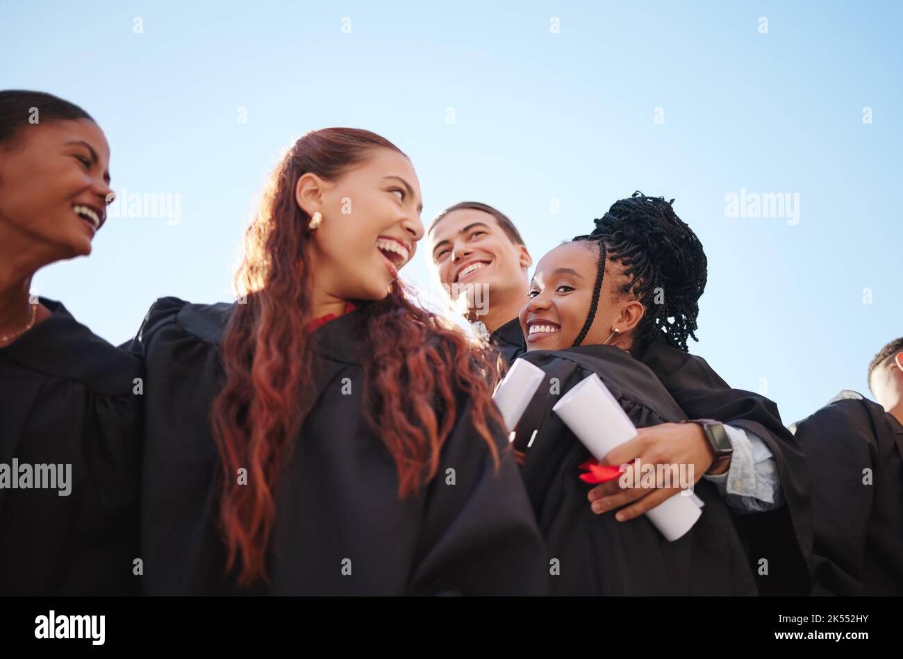 Students, hug and graduation certificate success in ceremony ...