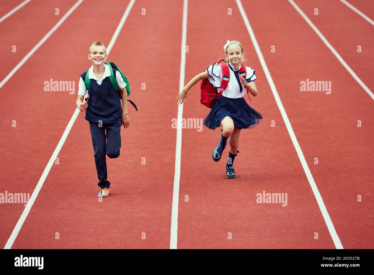 Start. Back to school, kids and education concept. Girl and boy dressed ...