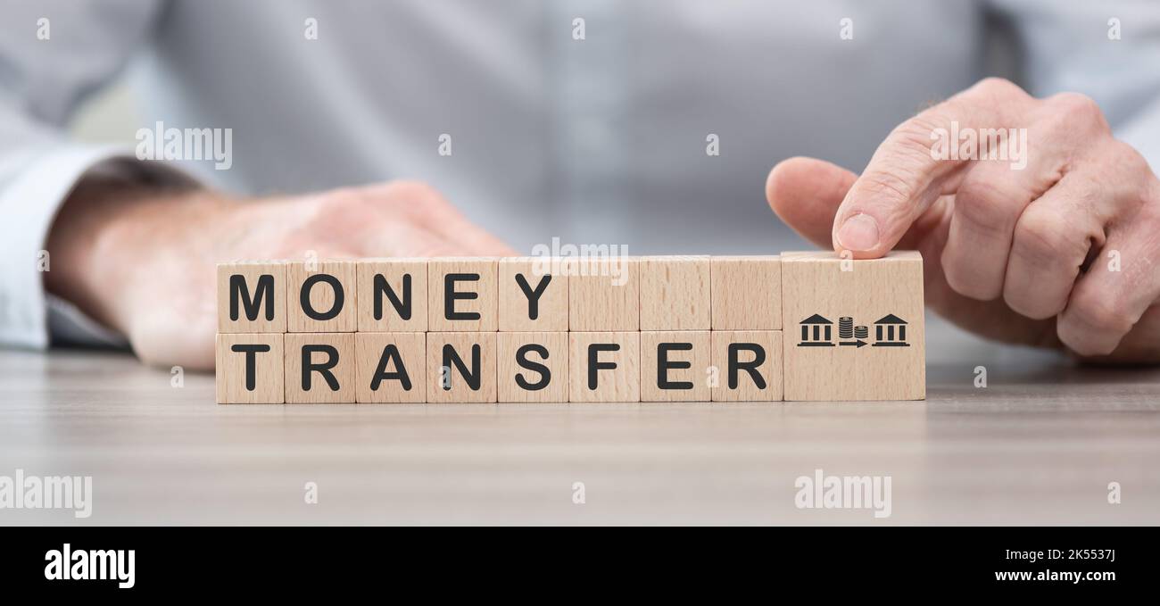 Wooden blocks with symbol of money transfer concept Stock Photo - Alamy