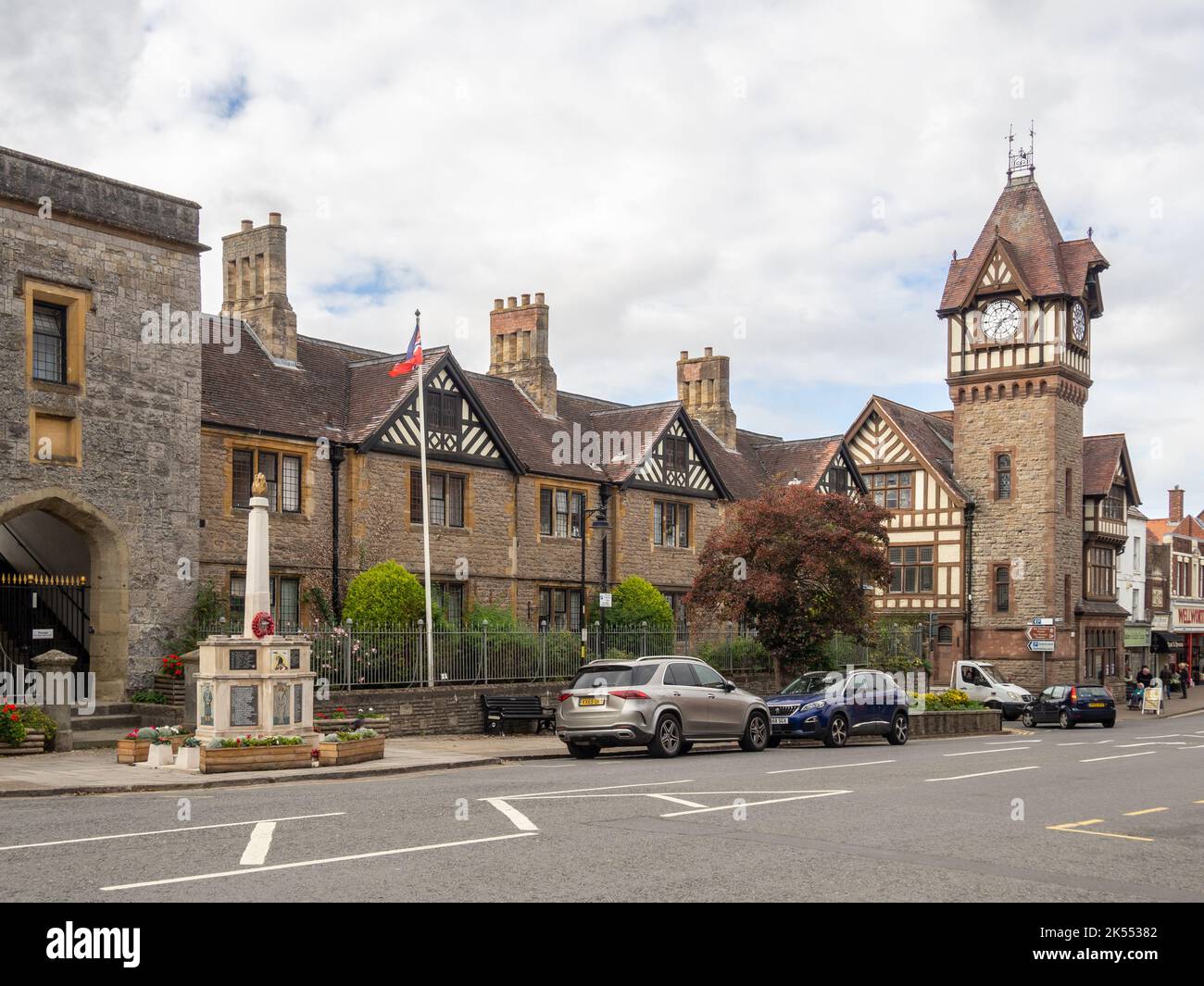 Street view, featuring the war memorial and clock tower in the market ...
