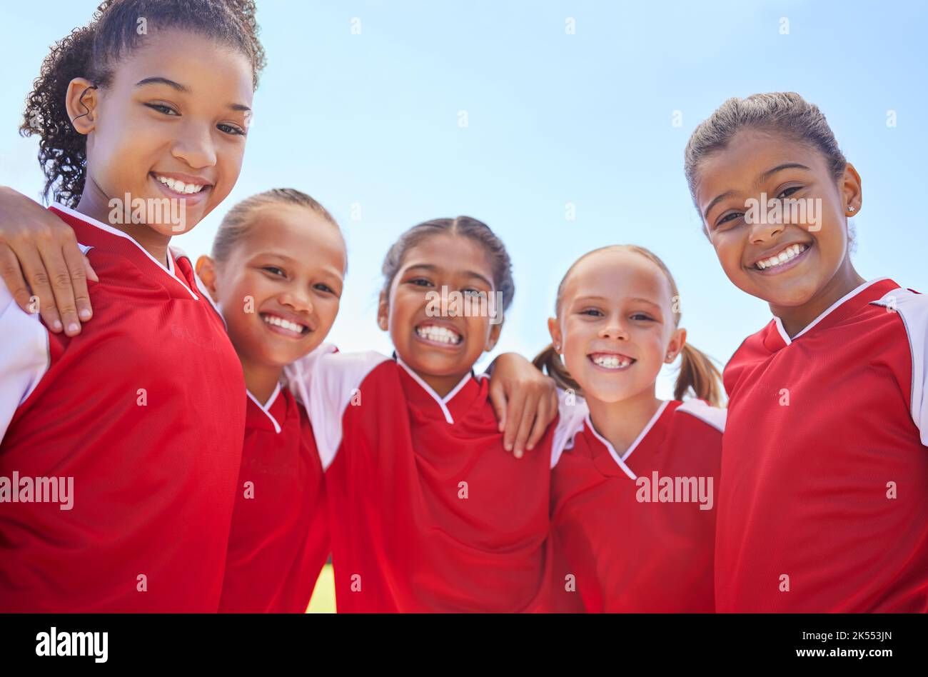 Girl team, in soccer and happy with teamwork and team building at ...