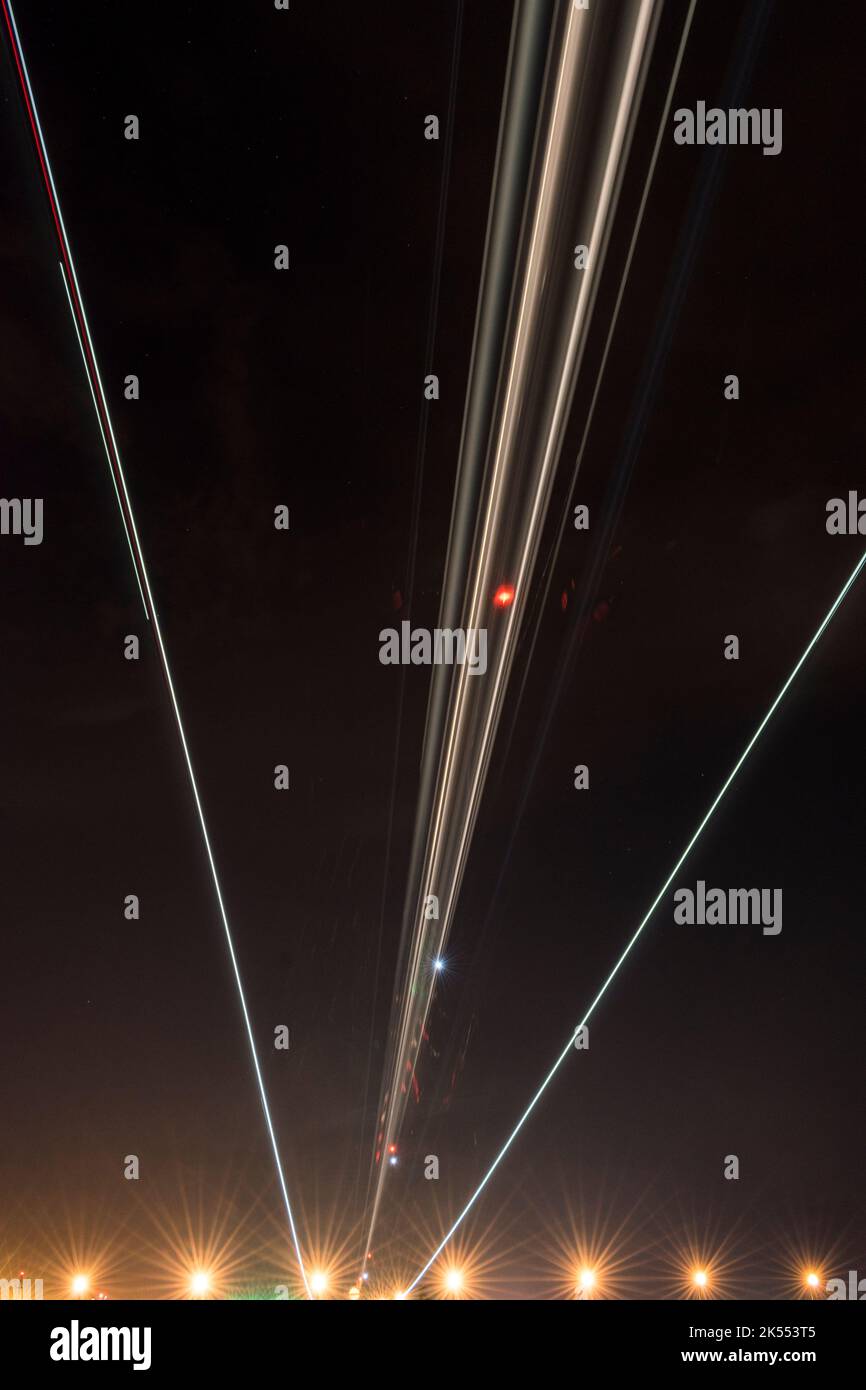 Lights in the sky from landing plane in the evening Stock Photo - Alamy