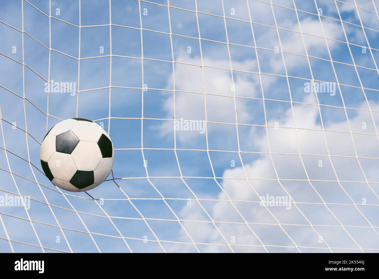 Soccer ball in net blue sky hi-res stock photography and images - Alamy