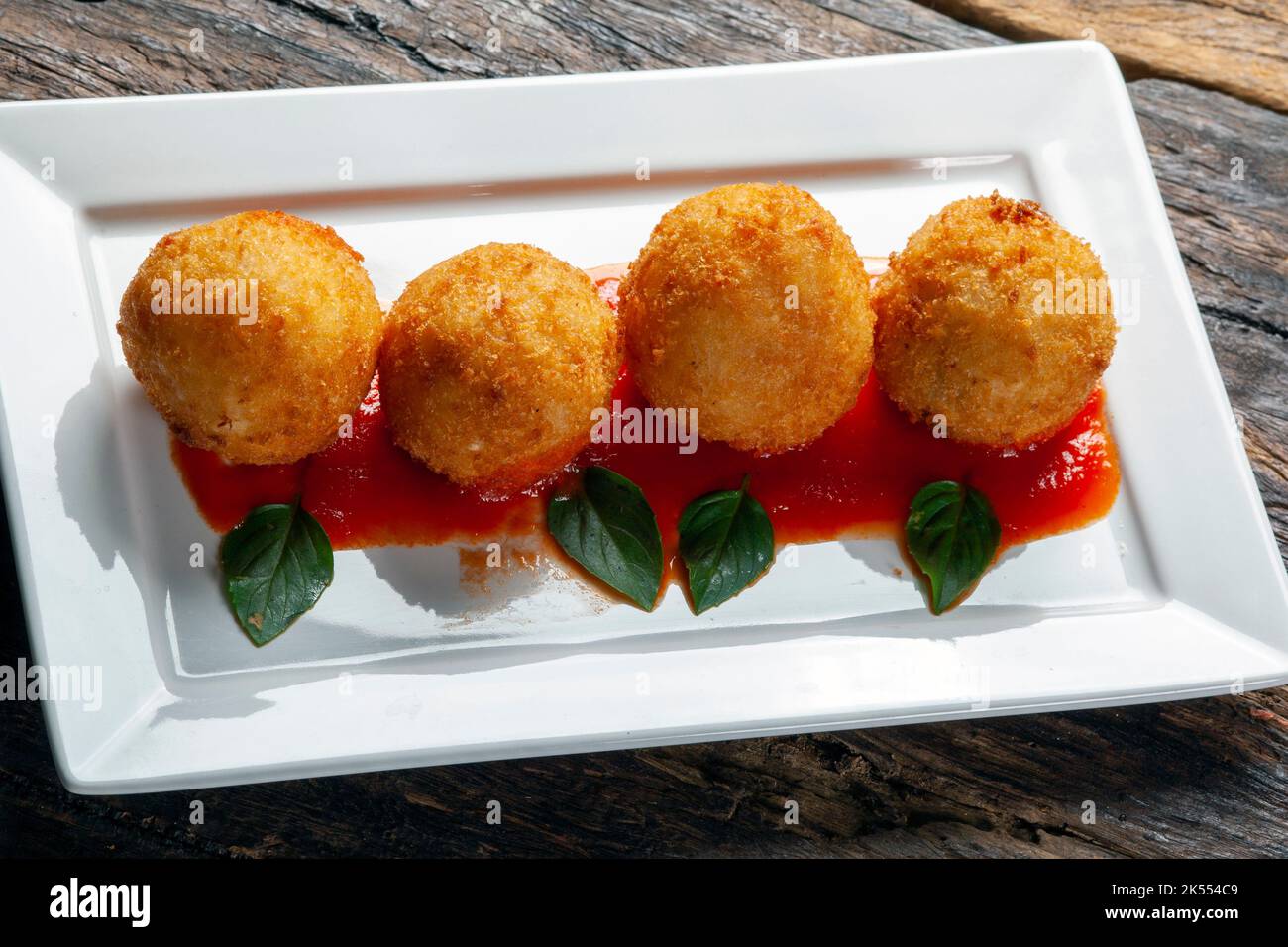 Fried rice balls. Traditional from Brazil where it is called Bolinho de ...